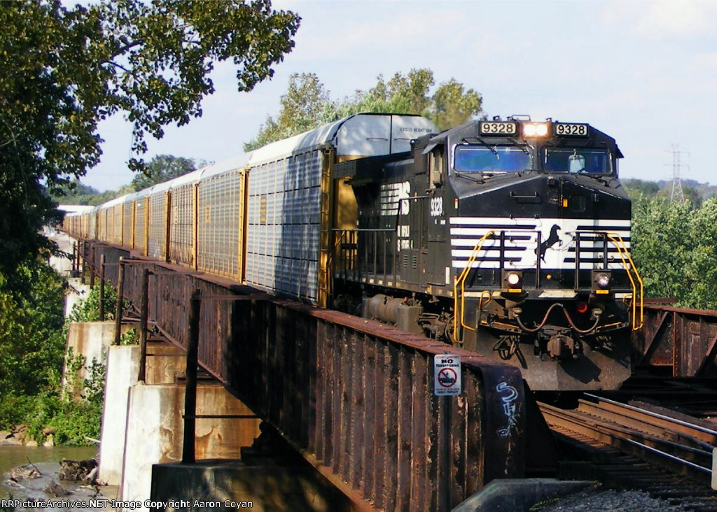 NS 9328 leads eastbound train 272 across the Scioto river bridge.